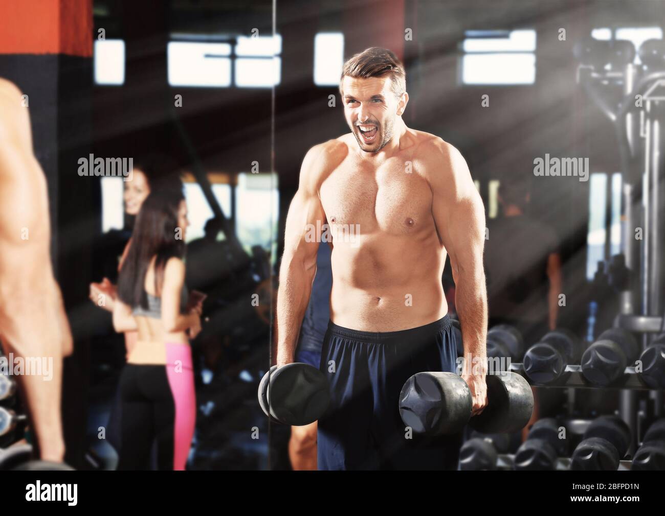 Man flexing muscles hi-res stock photography and images - Alamy
