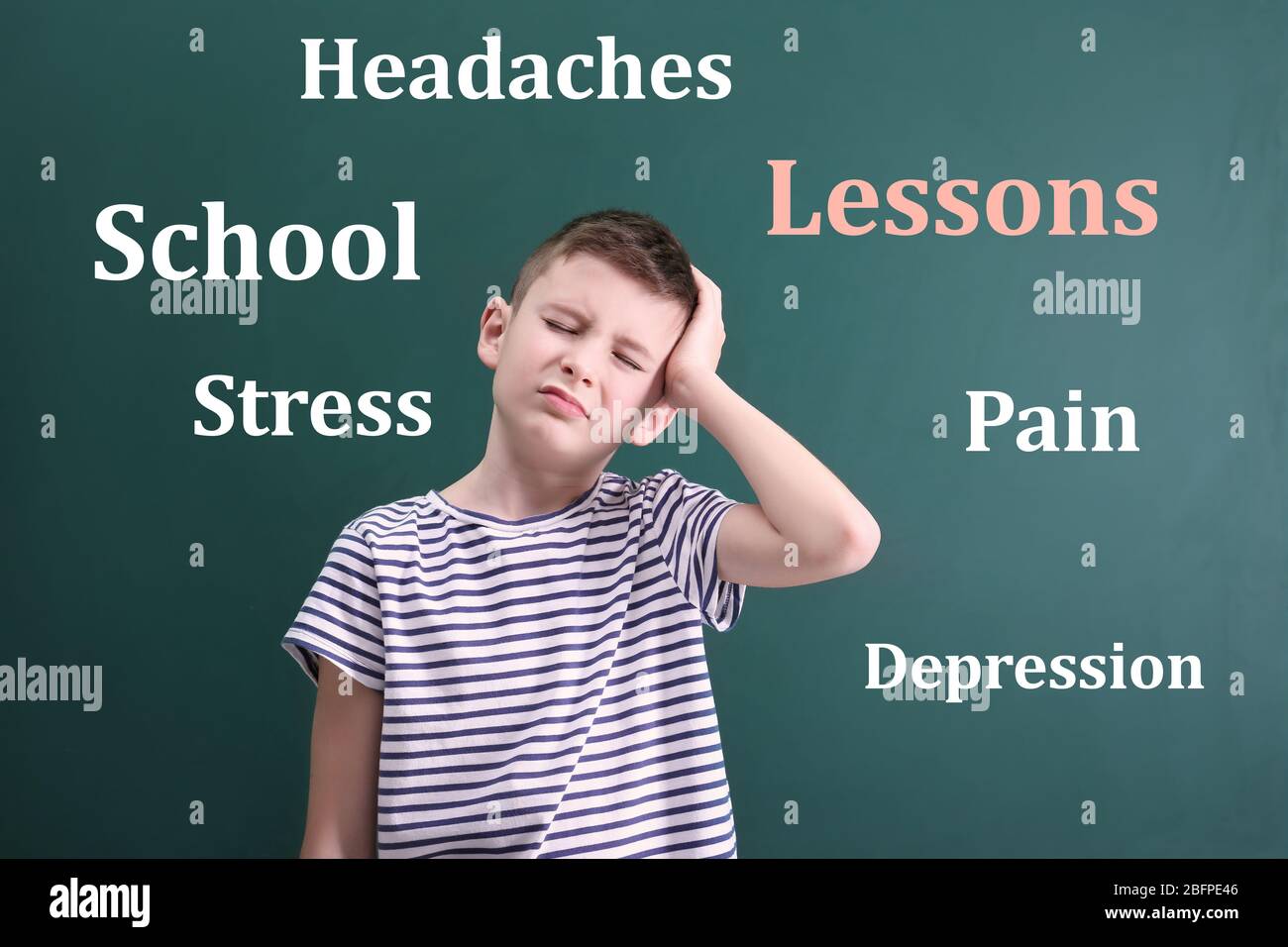 Little boy suffering from headaches on blackboard background Stock ...