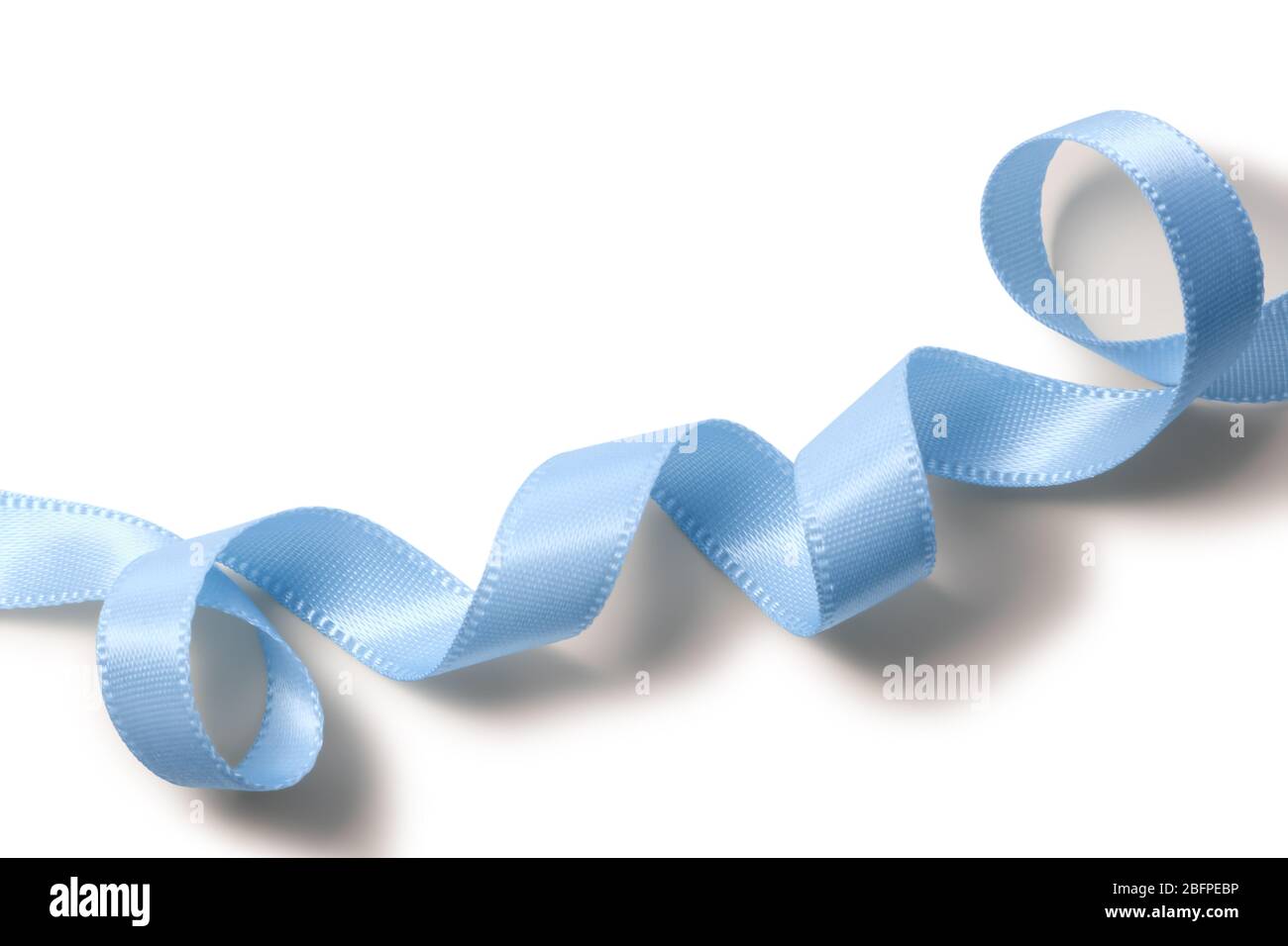 Shiny twisted satin ribbon in blue color isolated on white background ...