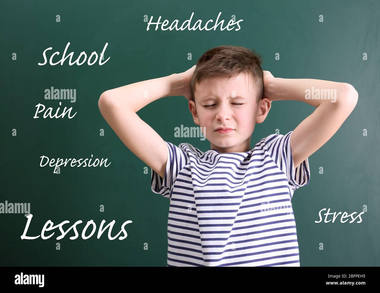 Little boy suffering from headaches on blackboard background Stock ...