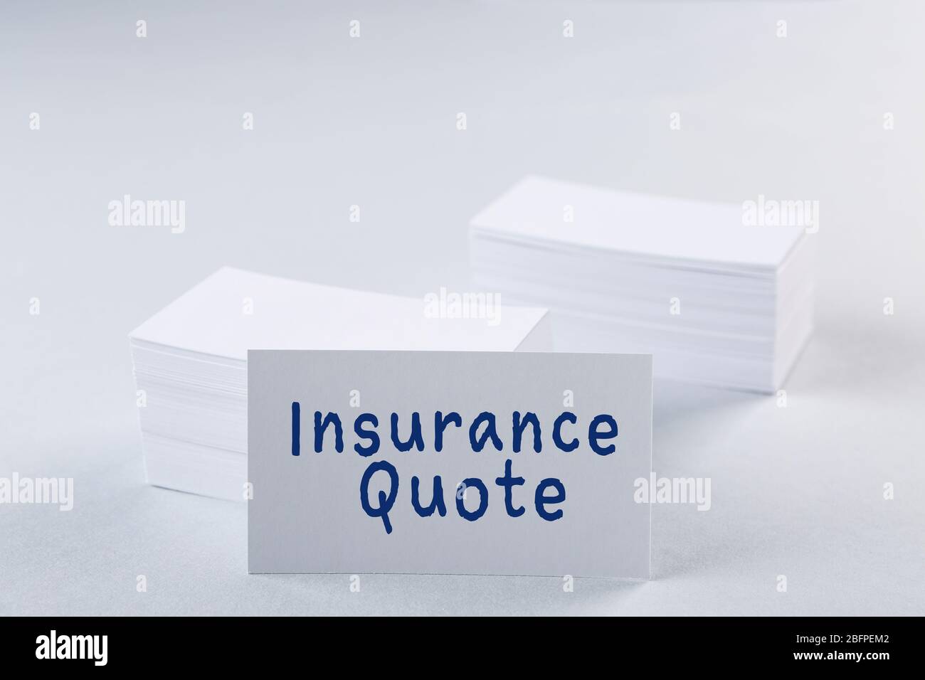 Insurance quote concept. Business cards on light background Stock Photo ...