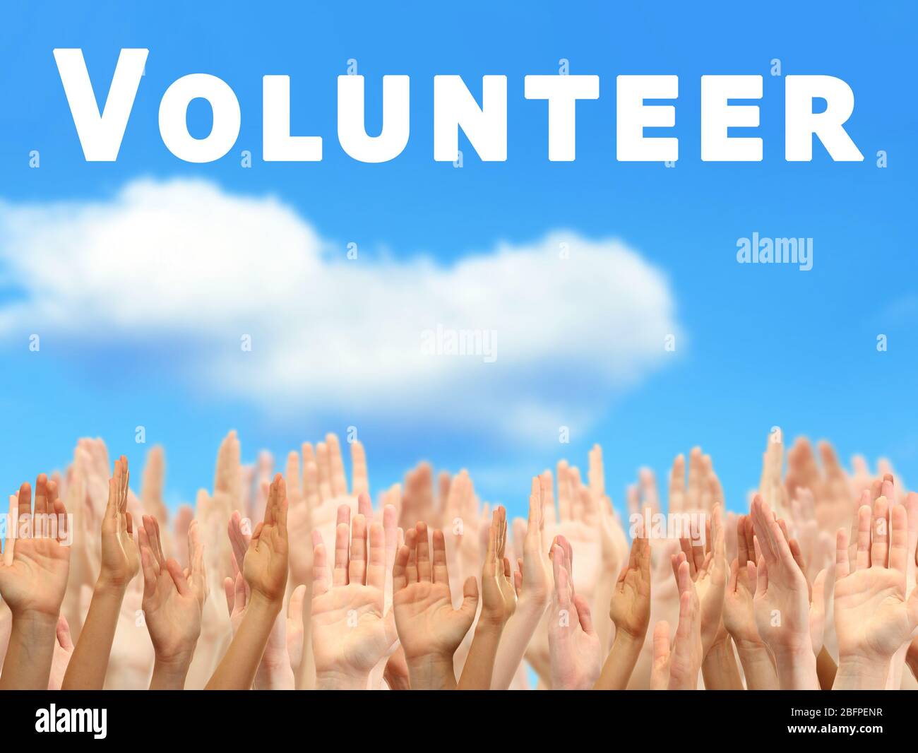 Volunteer concept. People raising hands and text on sky background ...