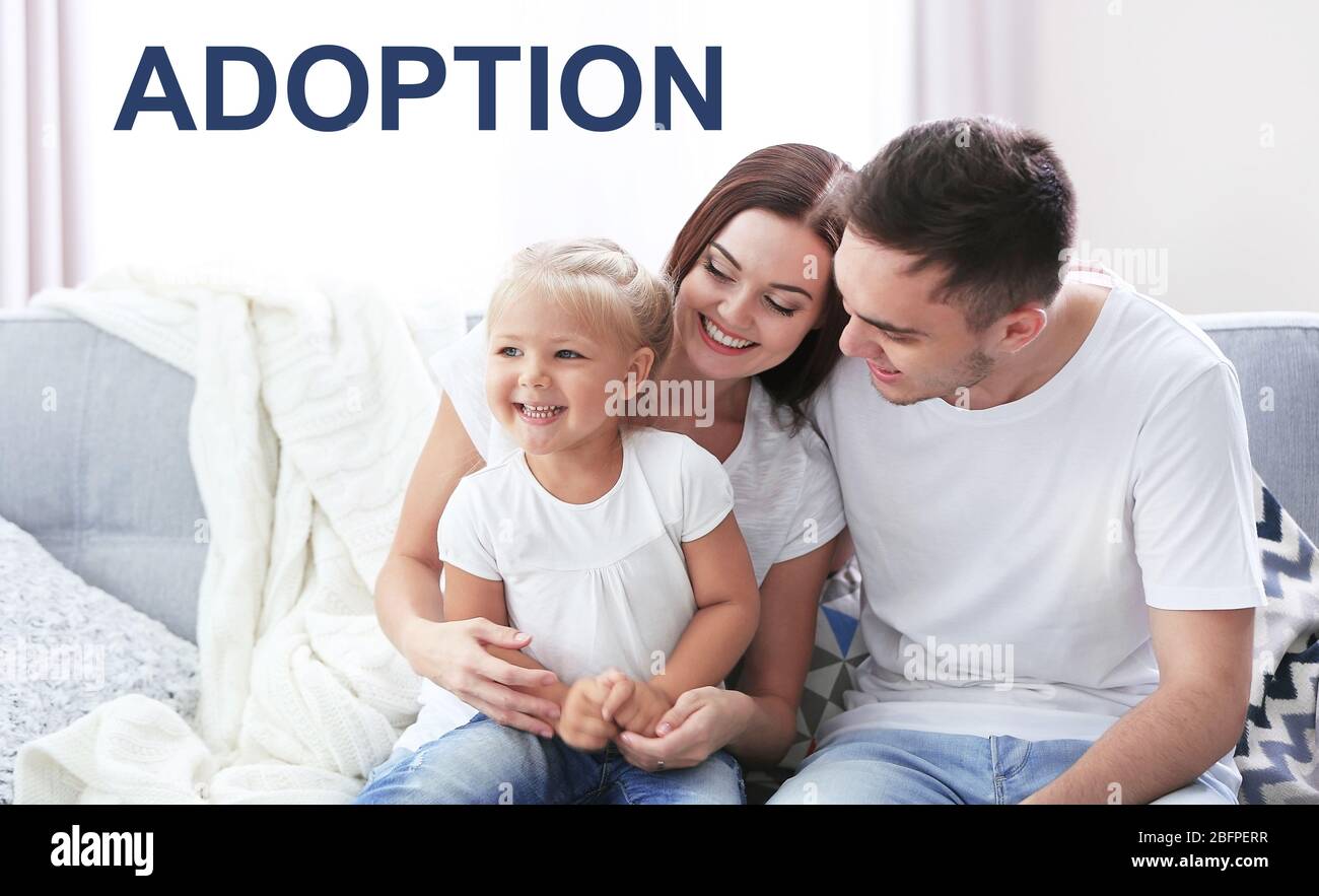 Adoption concept. Happy family sitting on couch at home Stock Photo - Alamy