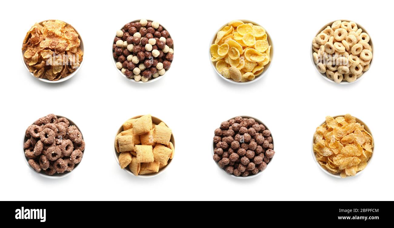 Bowls with different kinds of cereal breakfast on white background ...