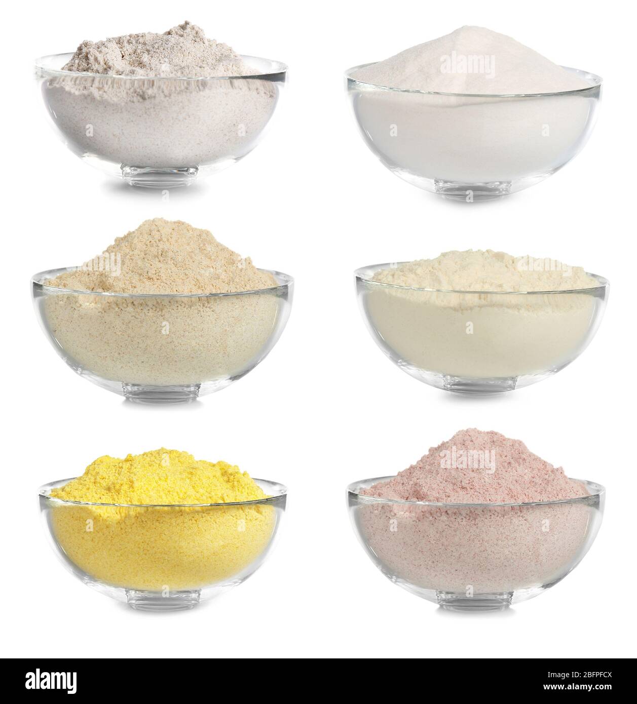 Different kinds of flour in bowls on white background Stock Photo - Alamy