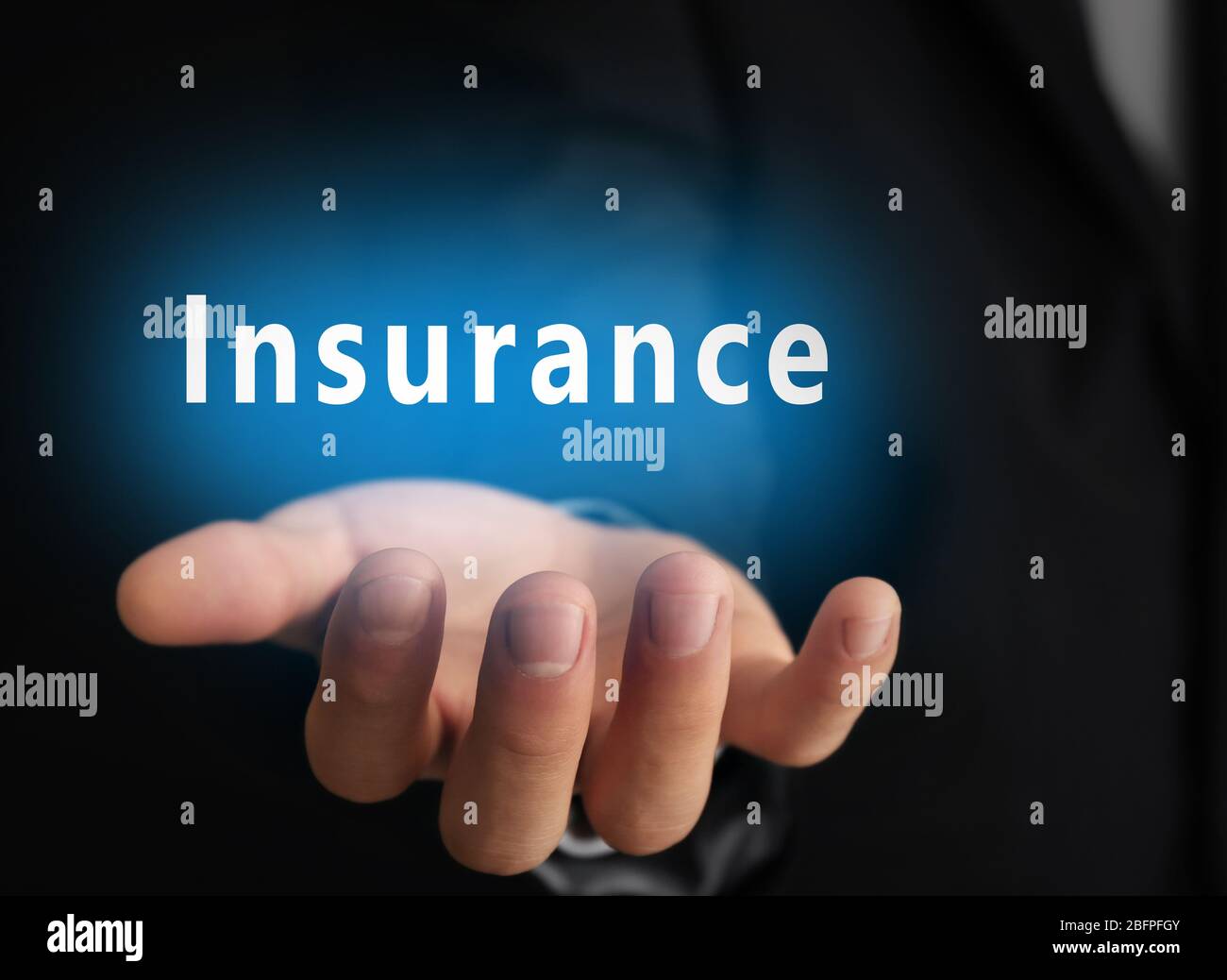 Insurance concept. Businessman holding word in hand, closeup Stock ...