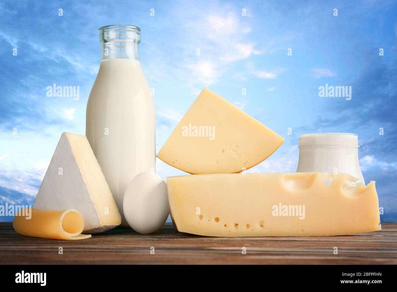 Assortment of fresh dairy products on sky background Stock Photo - Alamy