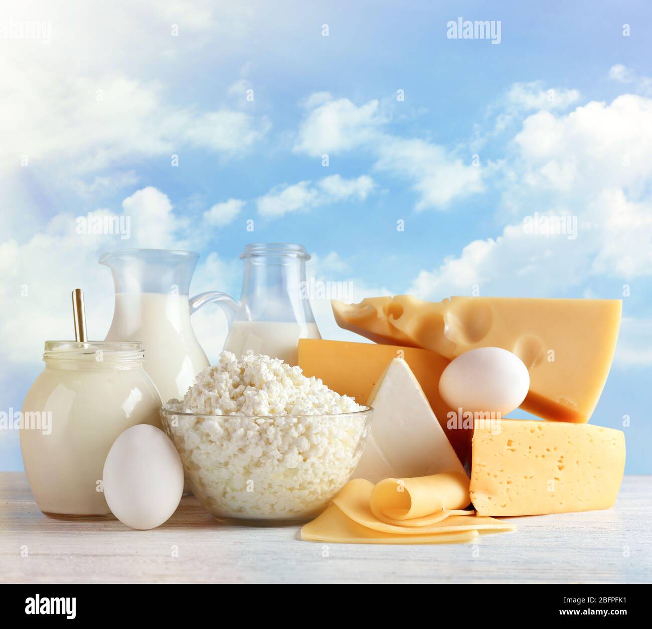 Assortment of fresh dairy products on sky background Stock Photo - Alamy