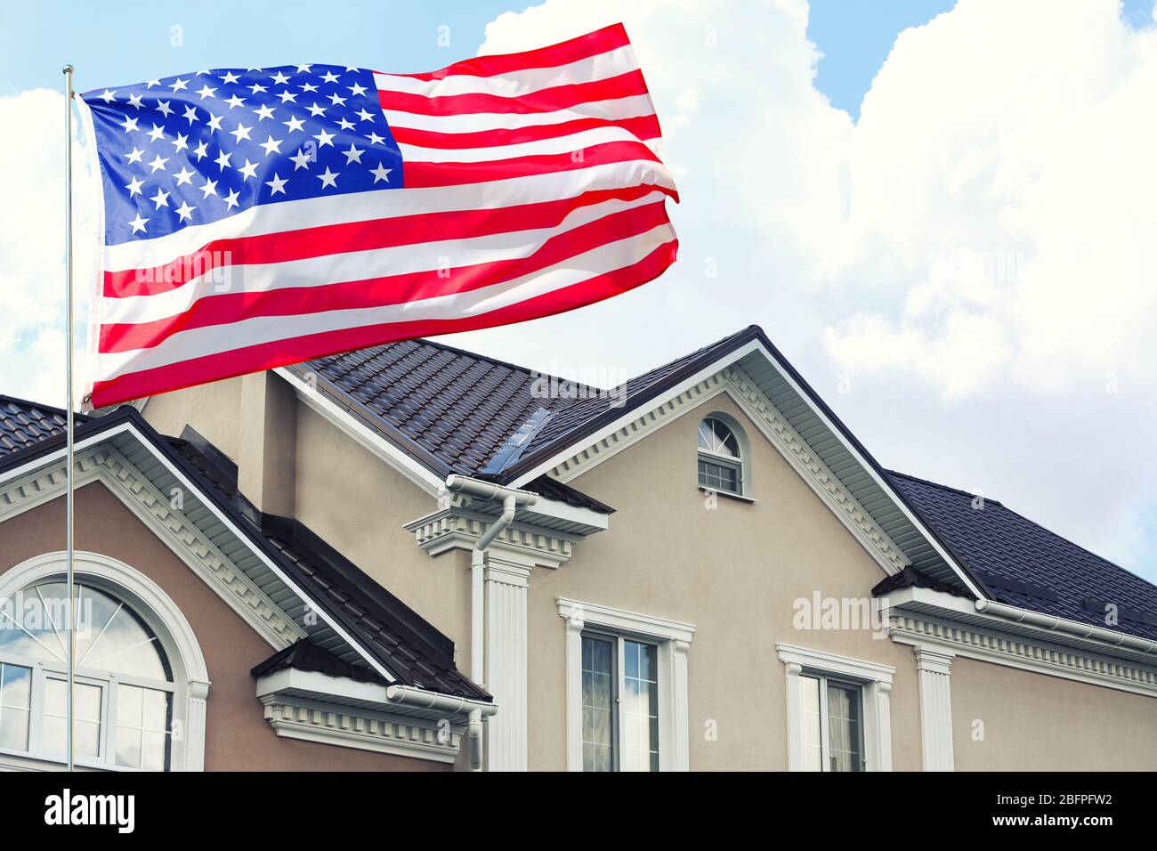 Us flag waving on house hi-res stock photography and images - Alamy