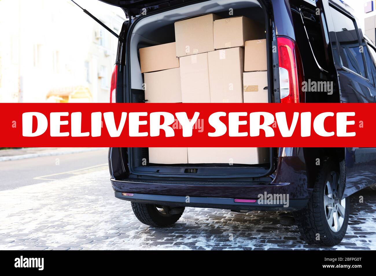 Delivery concept. Service van loaded with cardboard boxes outdoor Stock ...