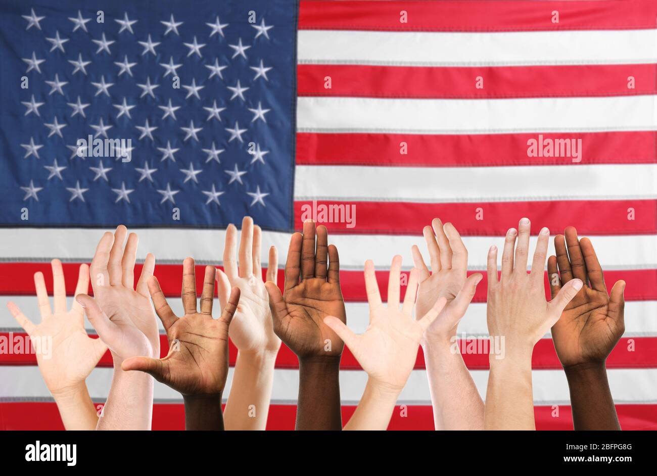 People raising hands and American flag on background. Patriotic concept ...