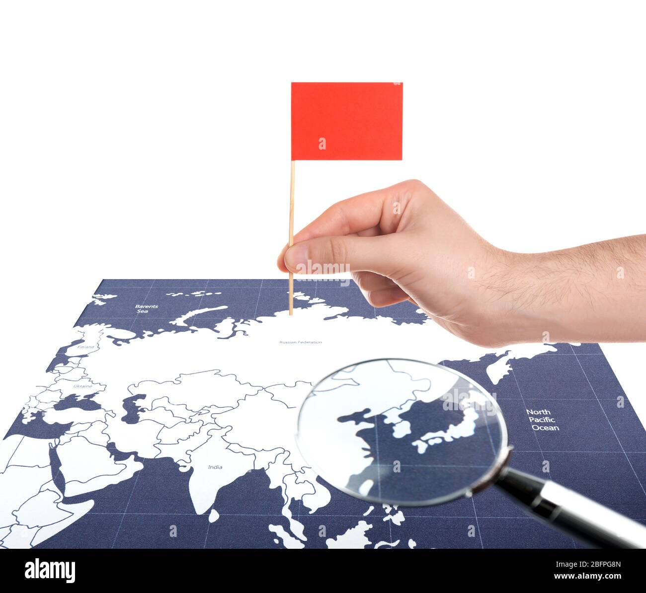 Man placing flag on world map, closeup. Earth concept Stock Photo - Alamy