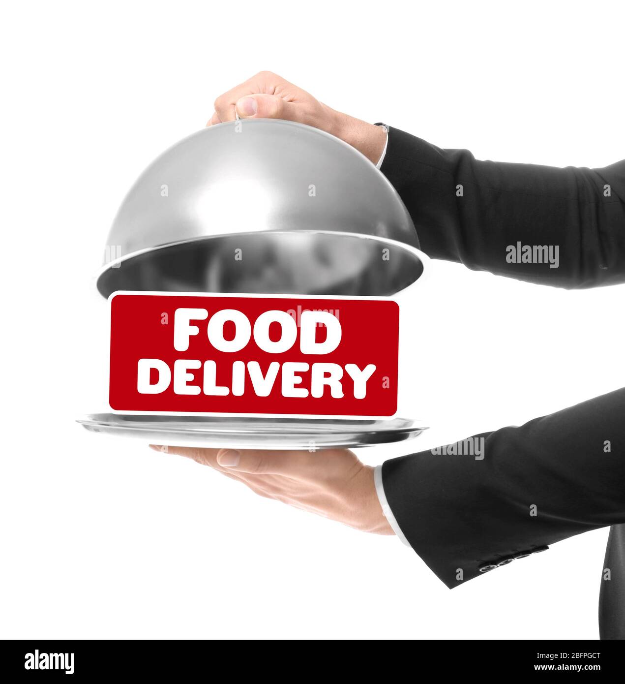 Food delivery concept. Waiter holding tray and cover on white ...