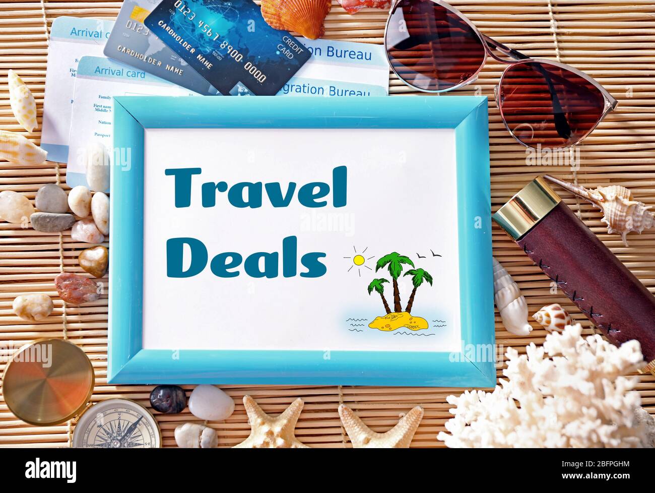 Frame with text TRAVEL DEALS and stuff on bamboo background. Concept of ...