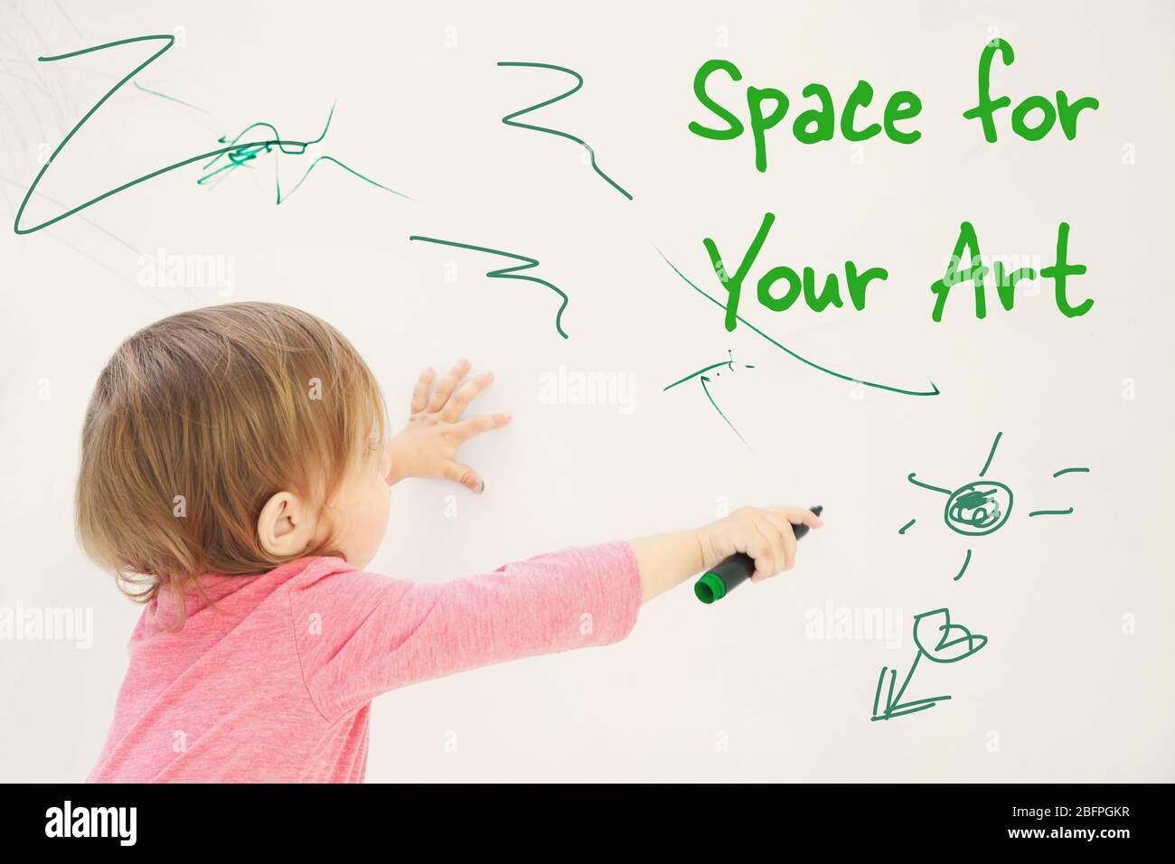 Art concept. Cute little girl drawing on light background with space ...