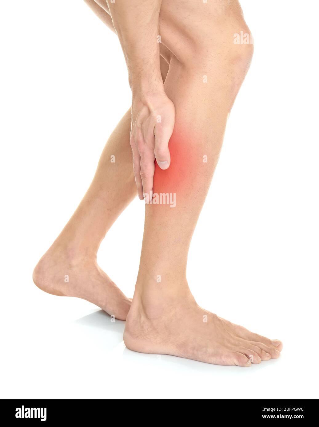 Concept of orthopedist. Man suffering from pain in calf on white ...