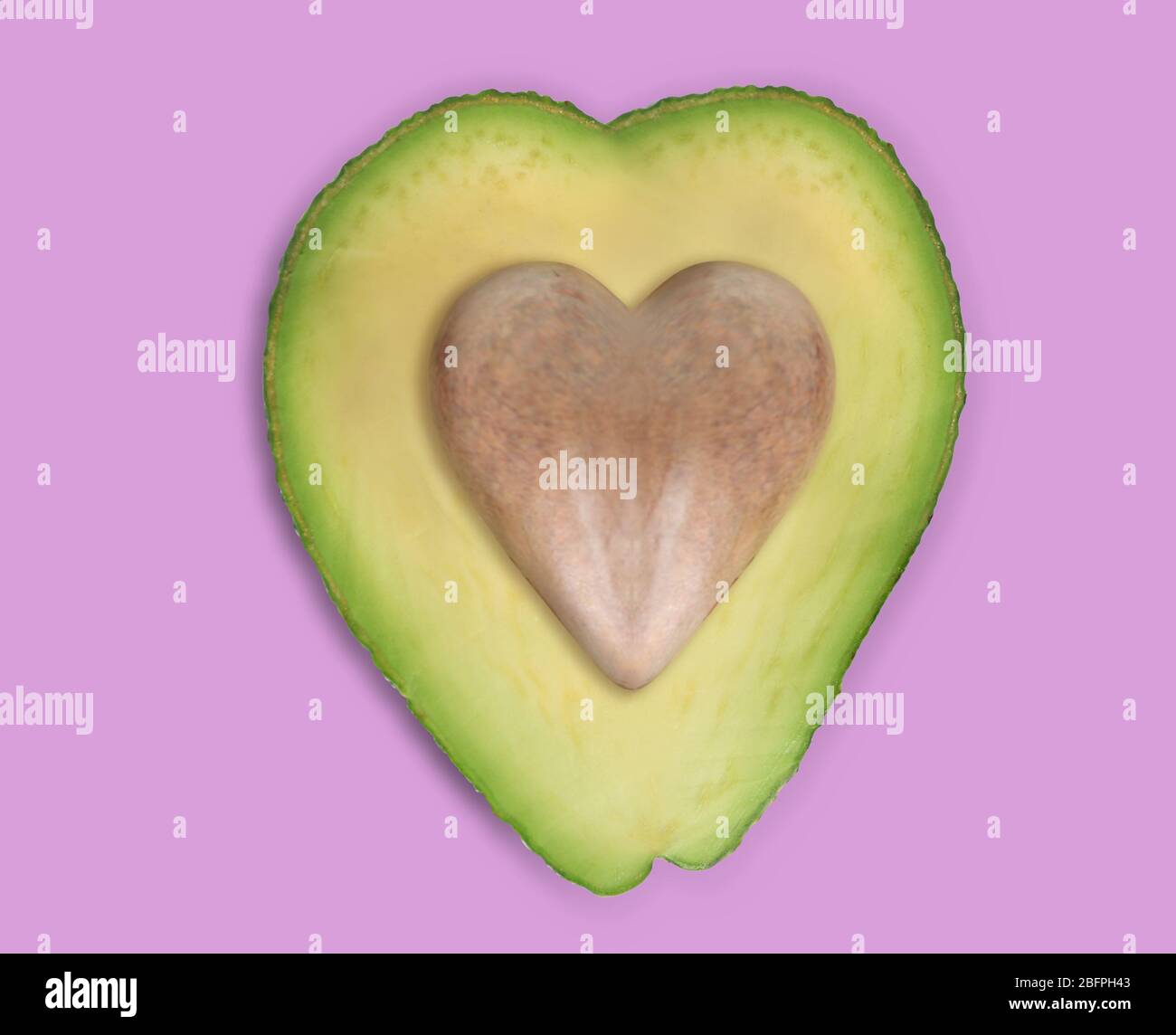 Heart shaped avocado on color background. Superfood concept Stock Photo ...