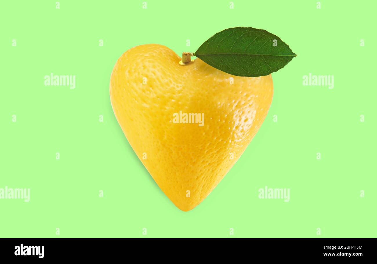 Heart shaped lemon on color background. Superfood concept Stock Photo ...