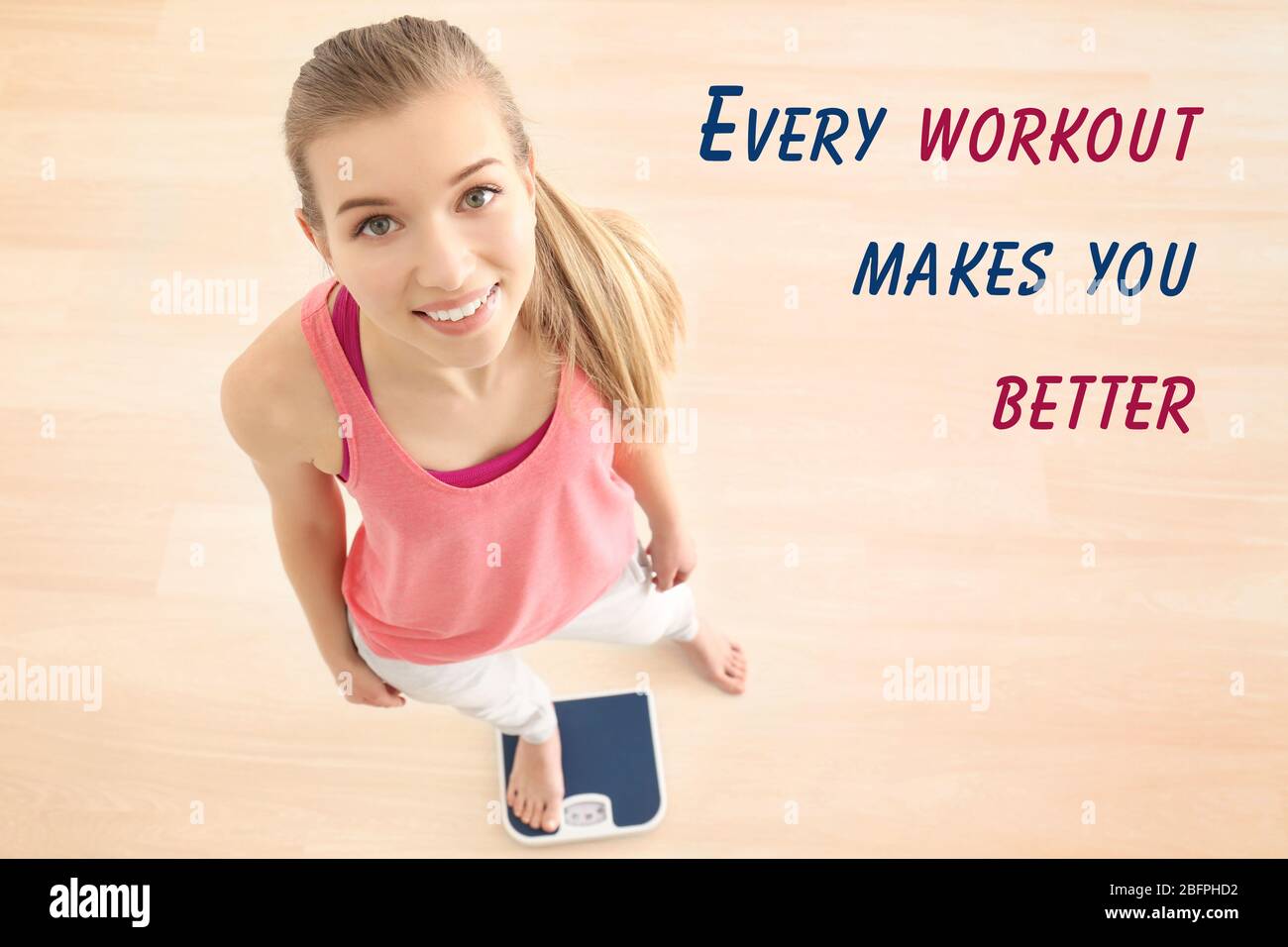 Weight loss motivation concept. Young woman standing on scales at home ...