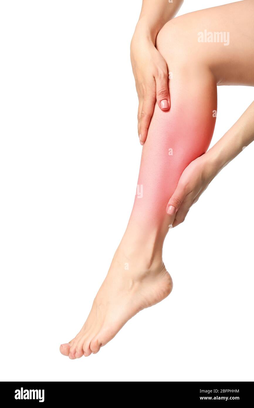 Health care concept. Woman suffering from pain in calf on white ...