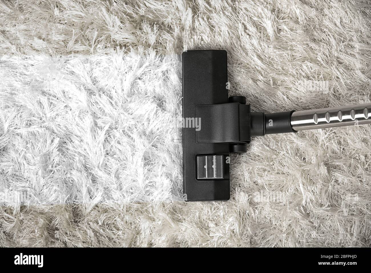 Cleaning service concept. Process of hoovering carpet with vacuum ...