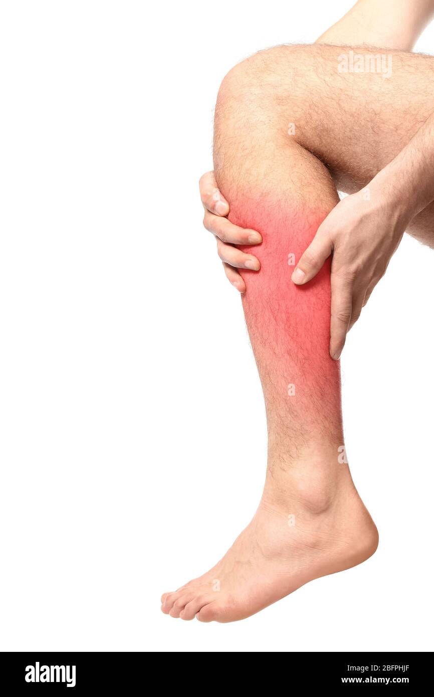 Health care concept. Man suffering from pain in calf on white ...