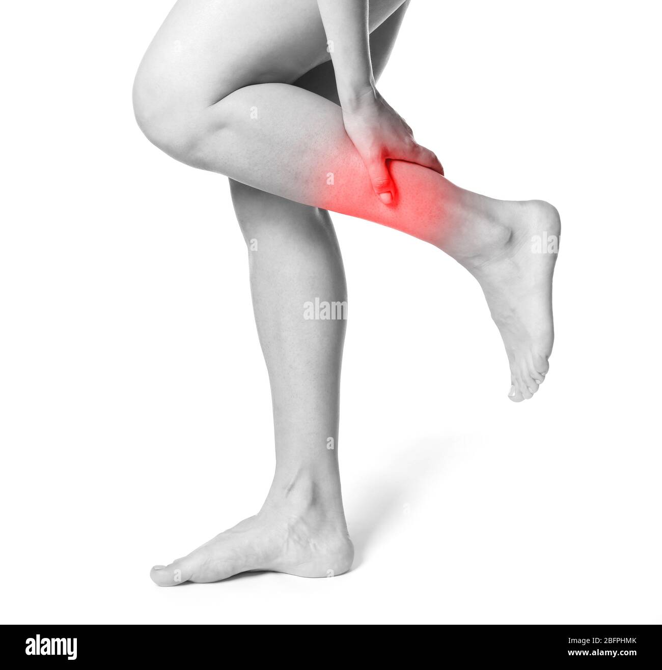 Health care concept. Woman suffering from pain in calf on white ...