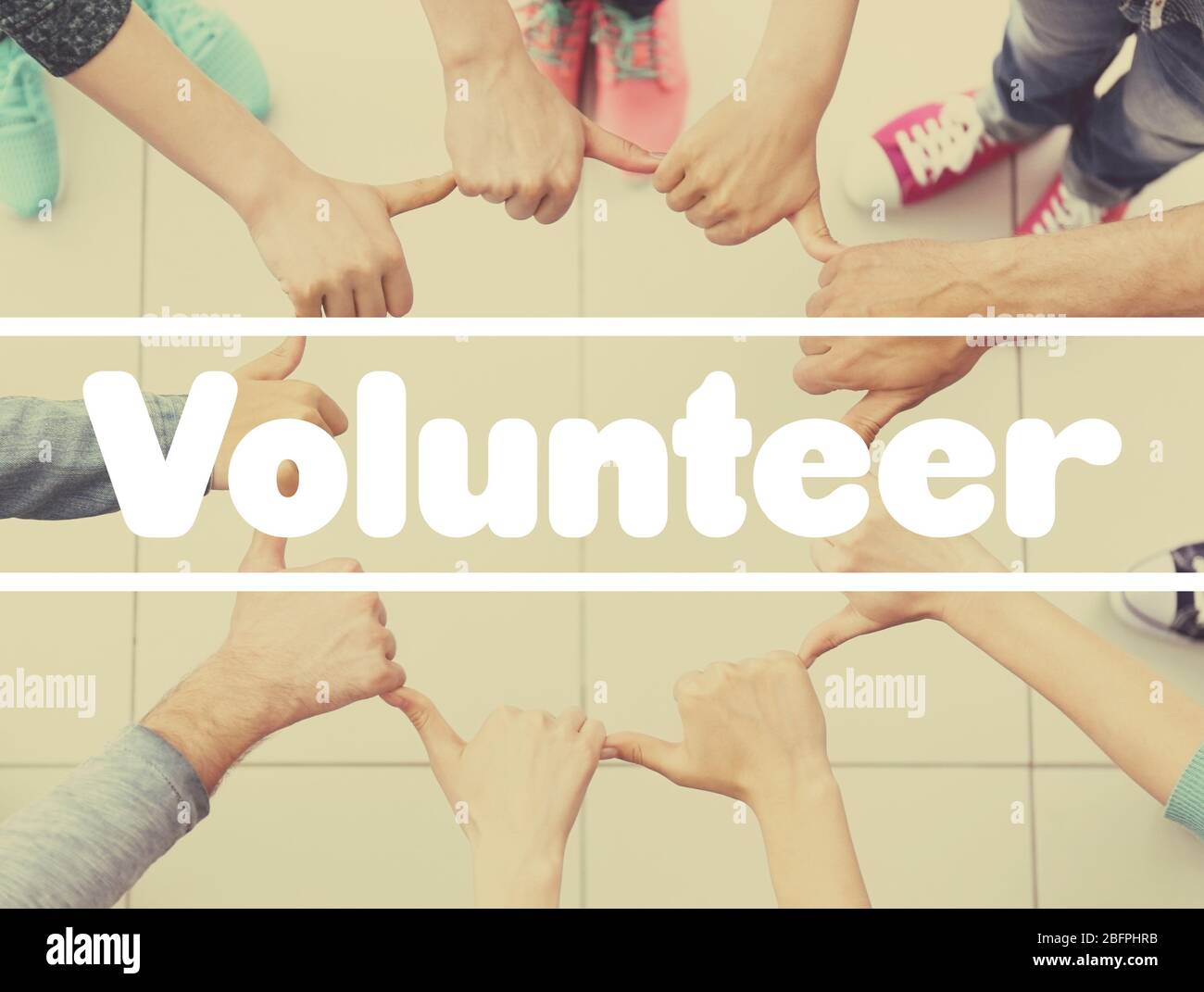 Word VOLUNTEER and people putting hands together in circle on ...