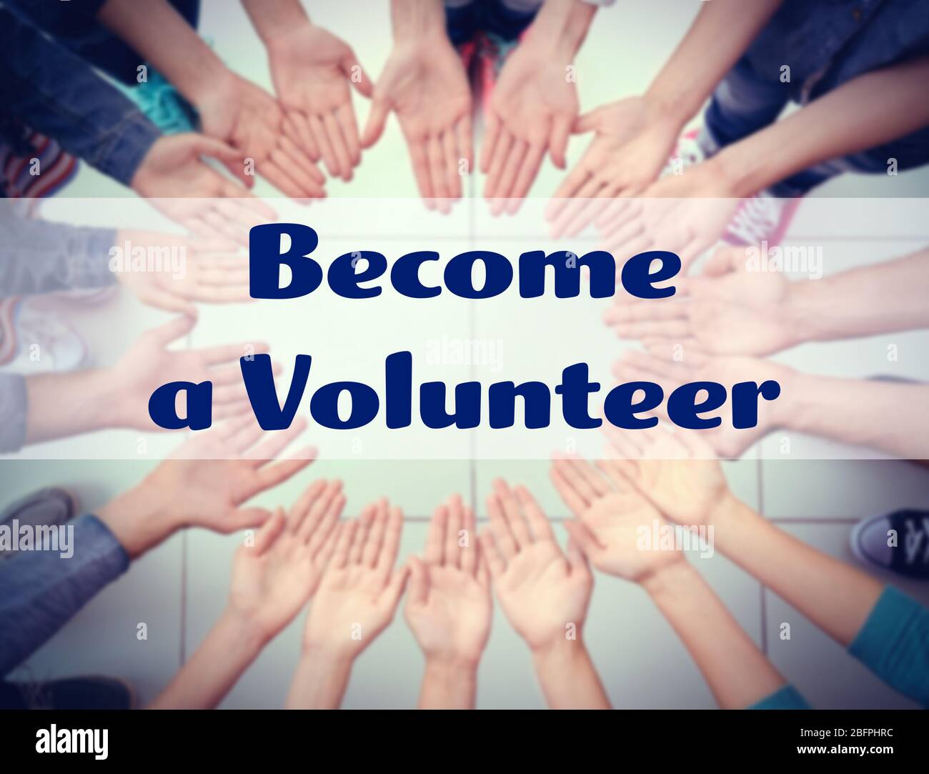Text BECOME A VOLUNTEER and people putting hands together in circle on ...