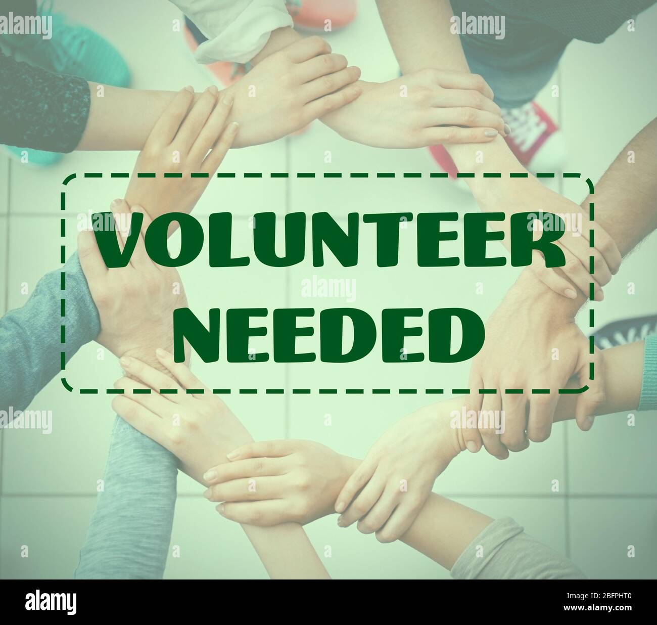 Text VOLUNTEER NEEDED and people putting hands together in circle on ...