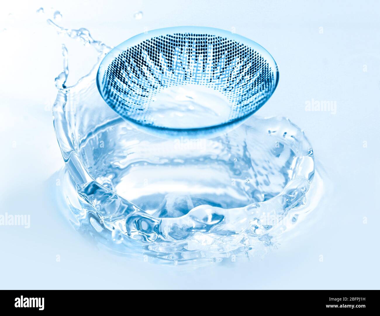 Eyesight correction concept. Contact lens and water splash, closeup ...