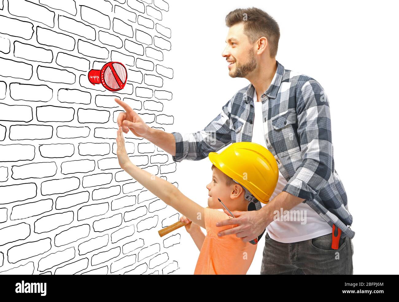 Father and son hammering drawn screw nail into wall on white background ...