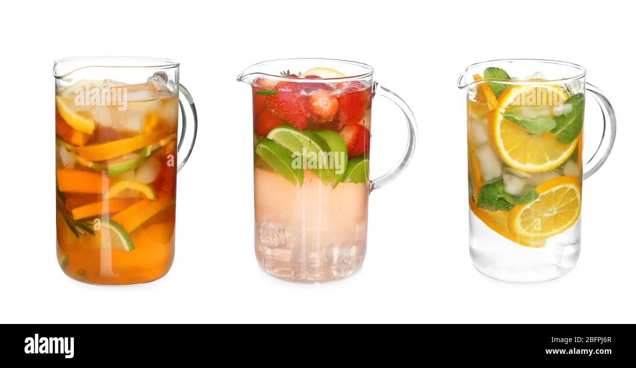 Different drinks in glass jugs on white background. Ideas for summer ...