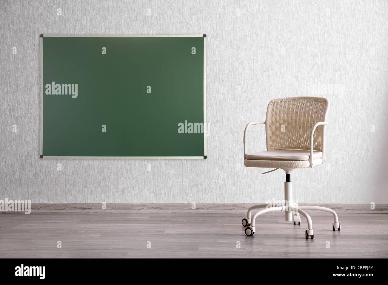 Chair and blank blackboard on wall in empty class room Stock Photo - Alamy
