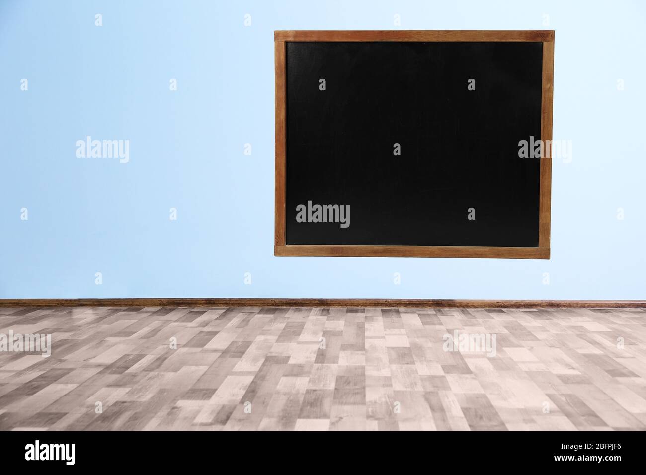 Blank blackboard on color wall in empty class room Stock Photo - Alamy