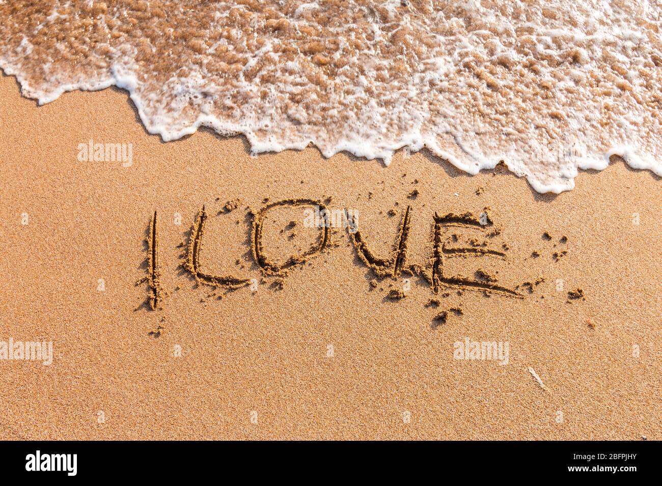 Romantic love lettering and heart sign on the beach beach Stock Photo ...