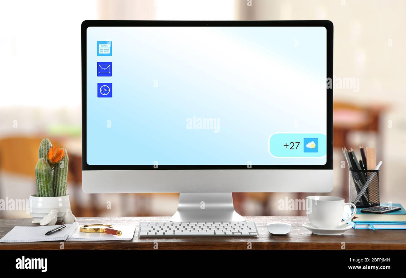 Modern computer on table in classroom Stock Photo - Alamy