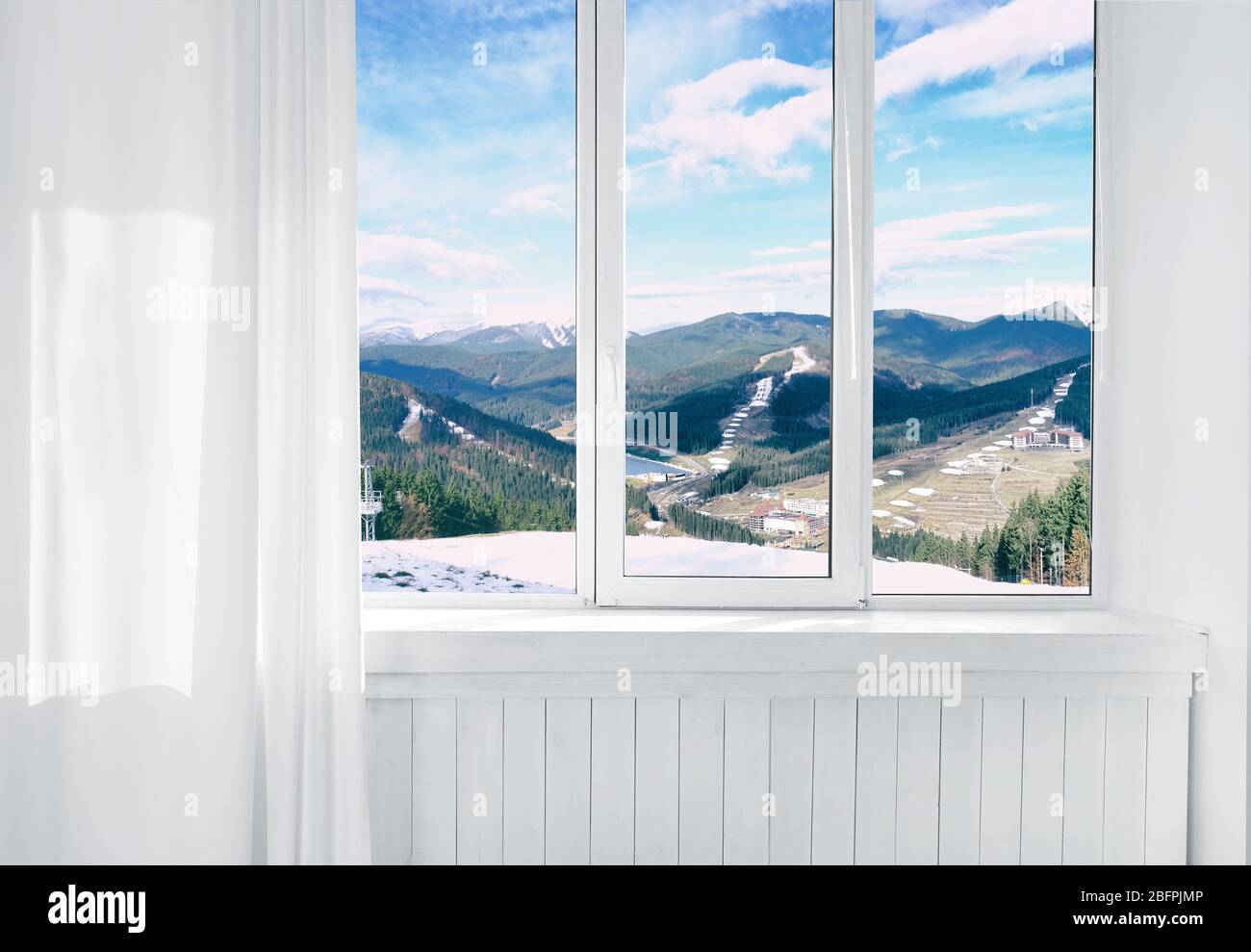 Landscape view through modern window in room Stock Photo - Alamy