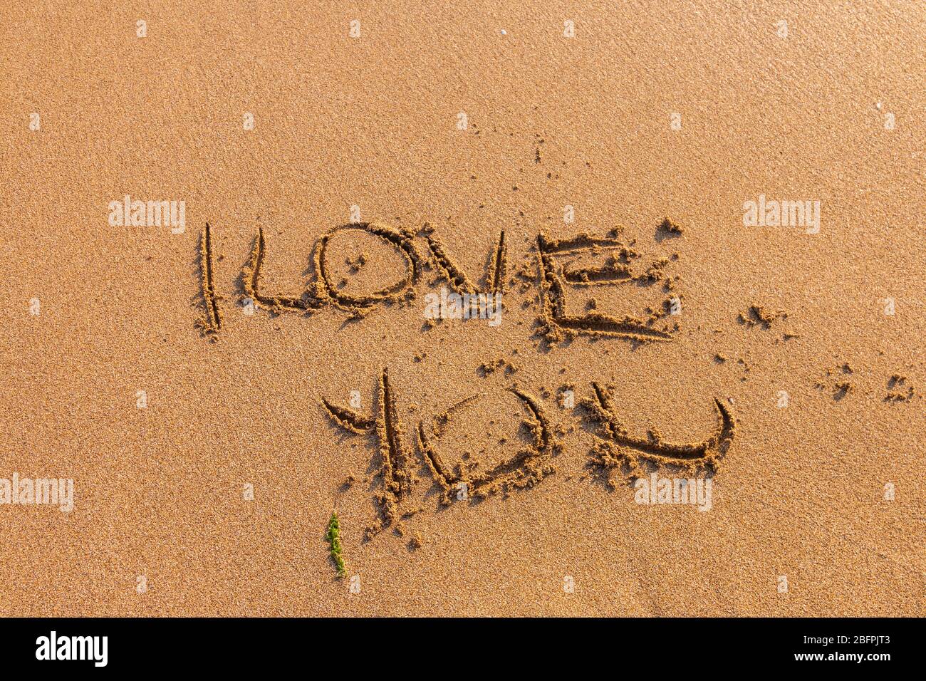 Romantic love lettering and heart sign on the beach beach Stock Photo ...