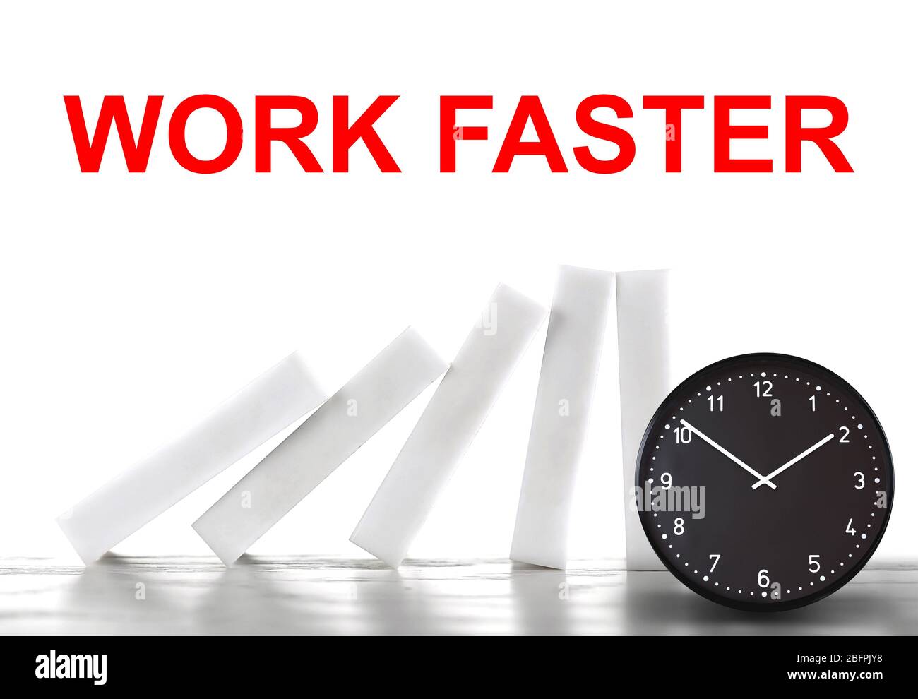 Clock with falling dominoes and text WORK FASTER on white background ...