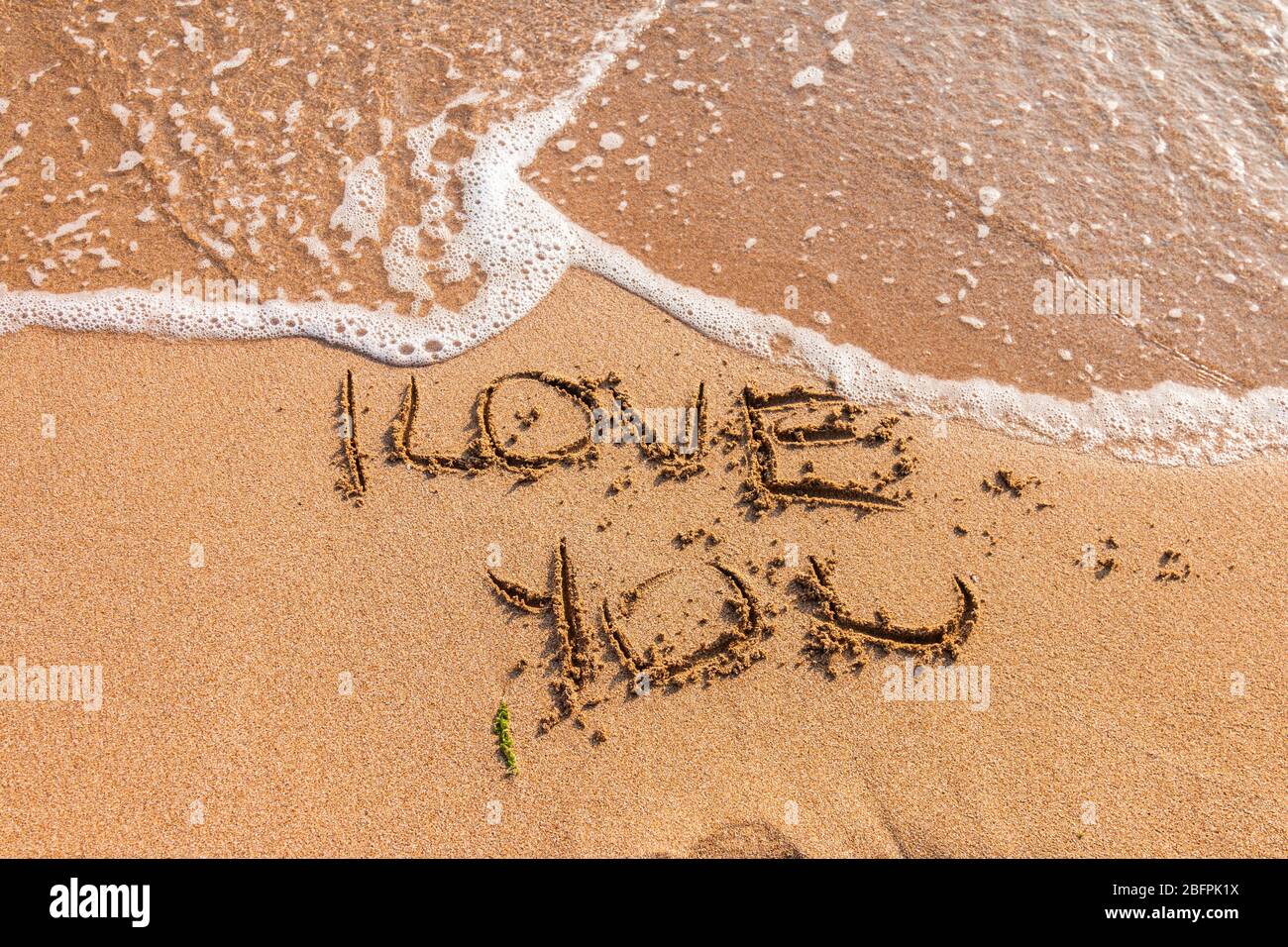 Romantic love lettering and heart sign on the beach beach Stock Photo ...