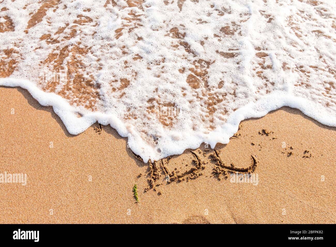 Romantic love lettering and heart sign on the beach beach Stock Photo ...