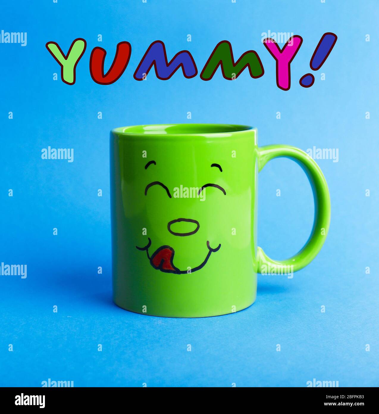 Word YUMMY and cup with funny face on color background Stock Photo - Alamy