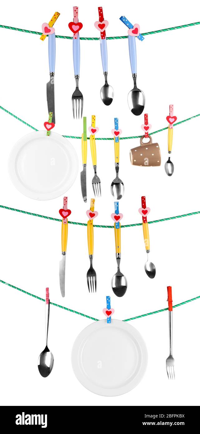 Different tableware hanging from clotheslines on white background Stock ...
