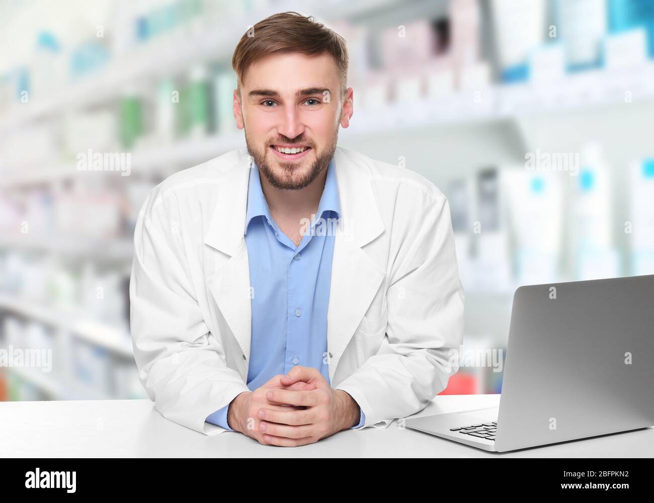 Portrait handsome young pharmacist chemist hi-res stock photography and ...