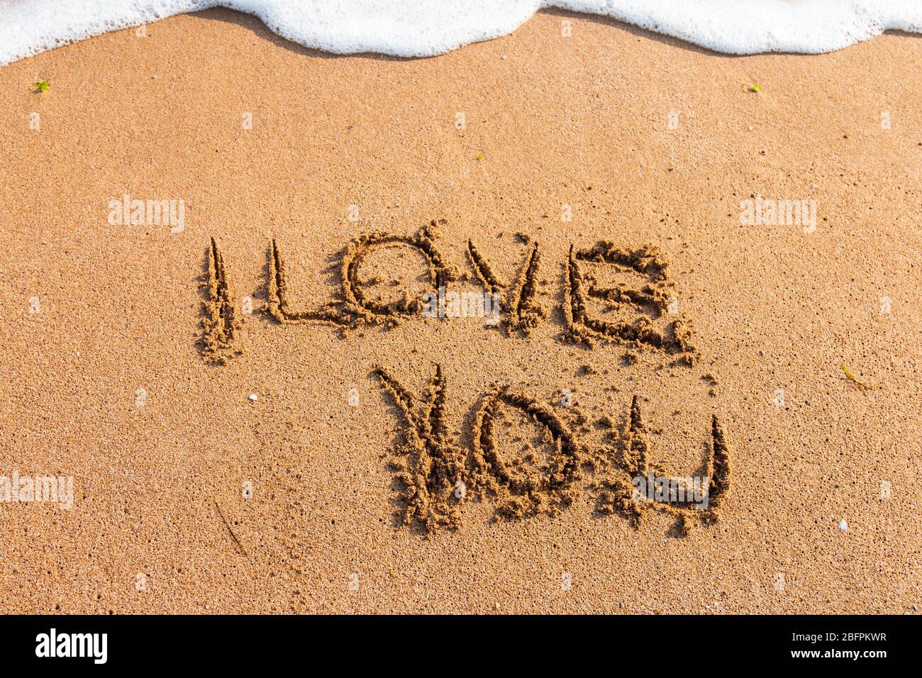 Romantic love lettering and heart sign on the beach beach Stock Photo ...