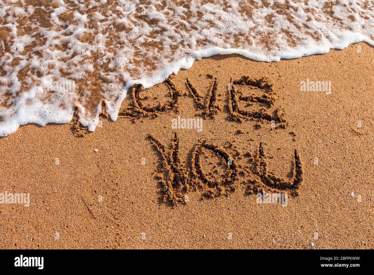 Romantic love lettering and heart sign on the beach beach Stock Photo ...