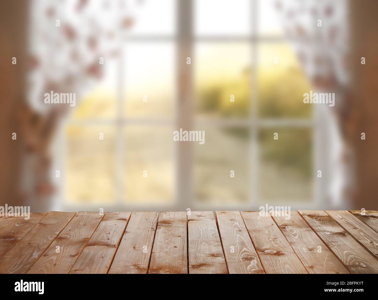 Wooden table and window on background Stock Photo - Alamy