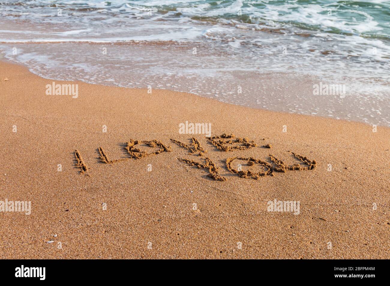 Romantic love lettering and heart sign on the beach beach Stock Photo ...