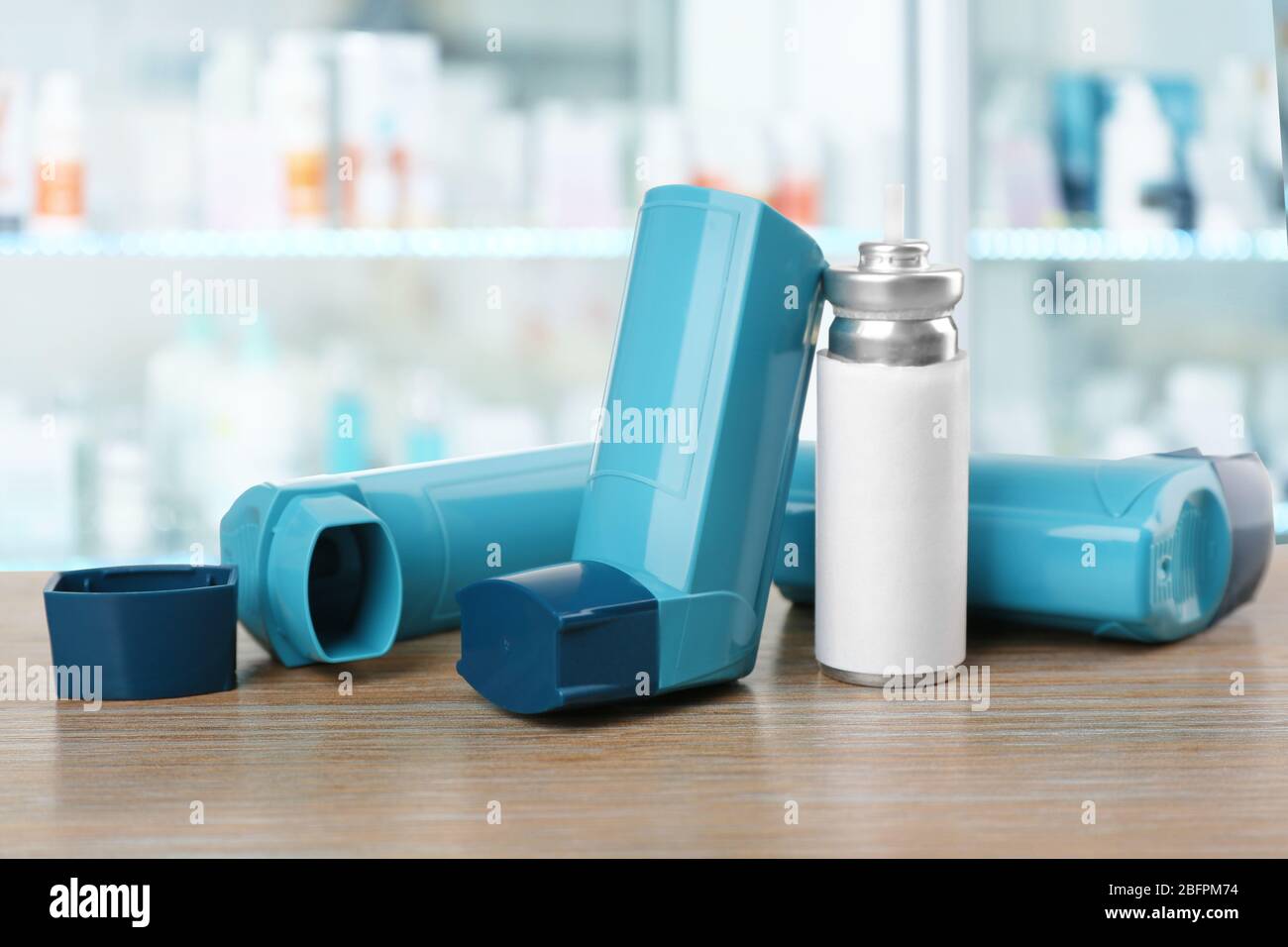 Concept of health care and asthma. Inhalers on counter at pharmacy ...